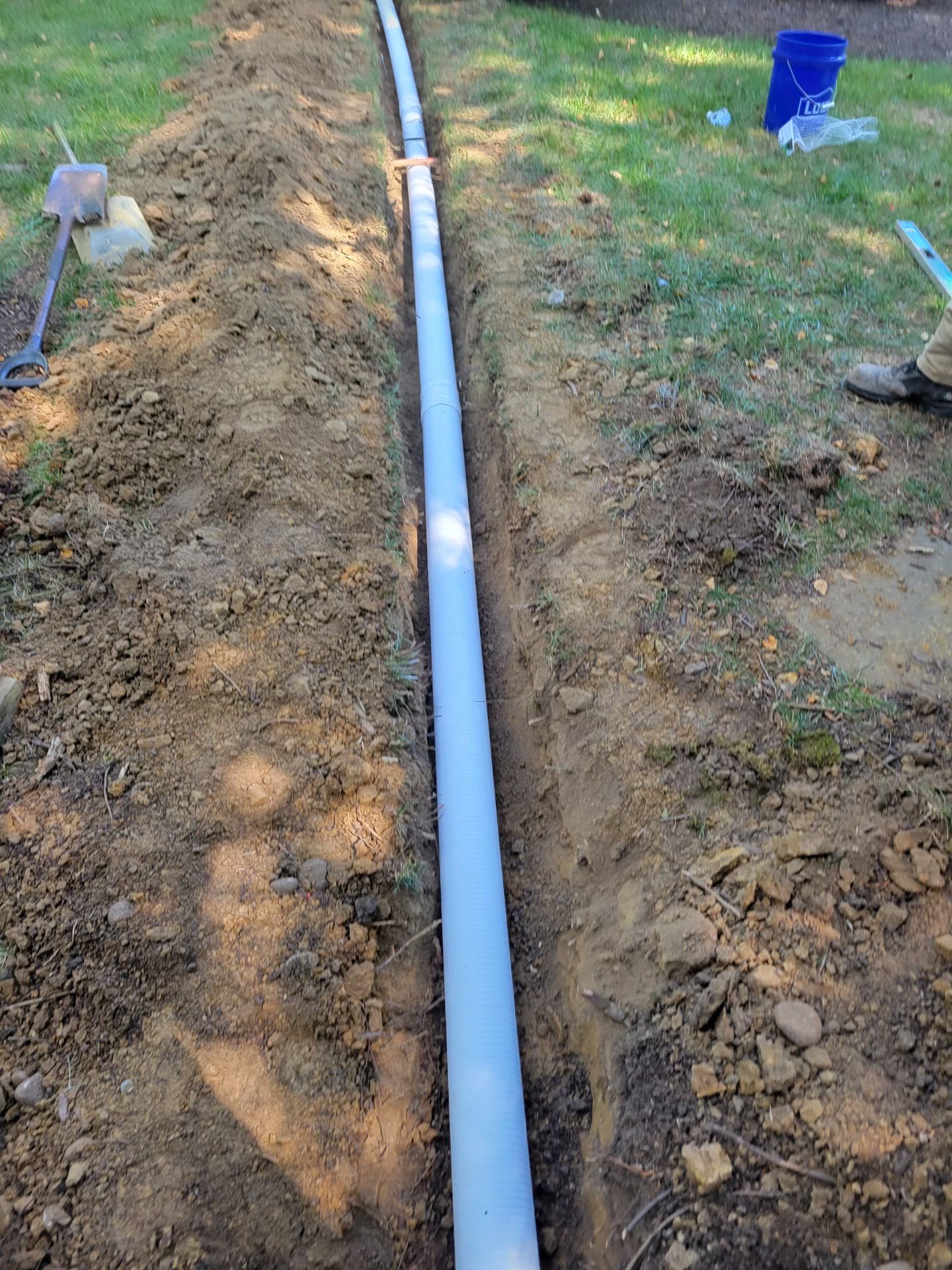 Benefits of Underground Downspout Systems - Guardian Gutters